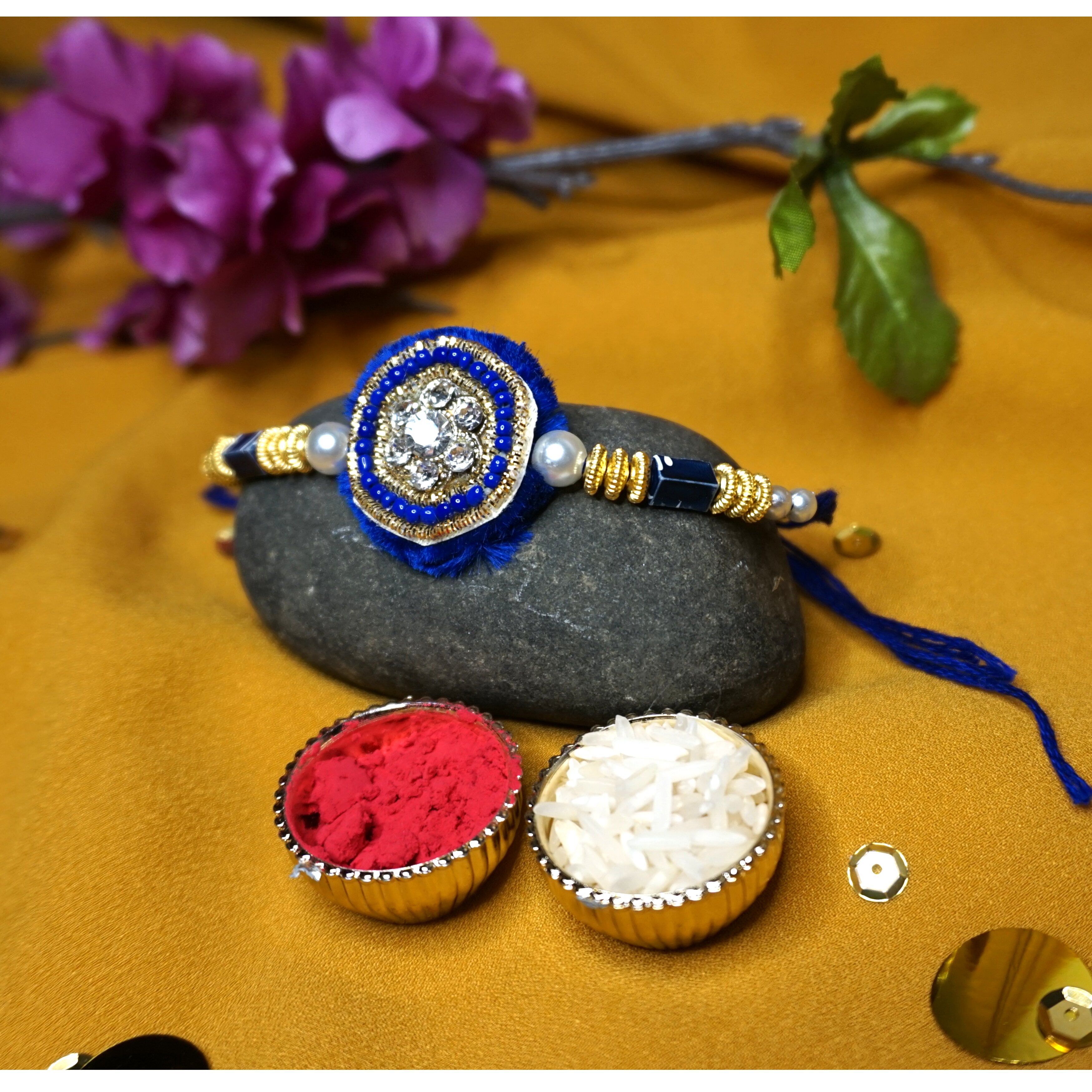 Designer Blue Round Rakhi Surrounded By Blue Beads + Roli & Chaval ...