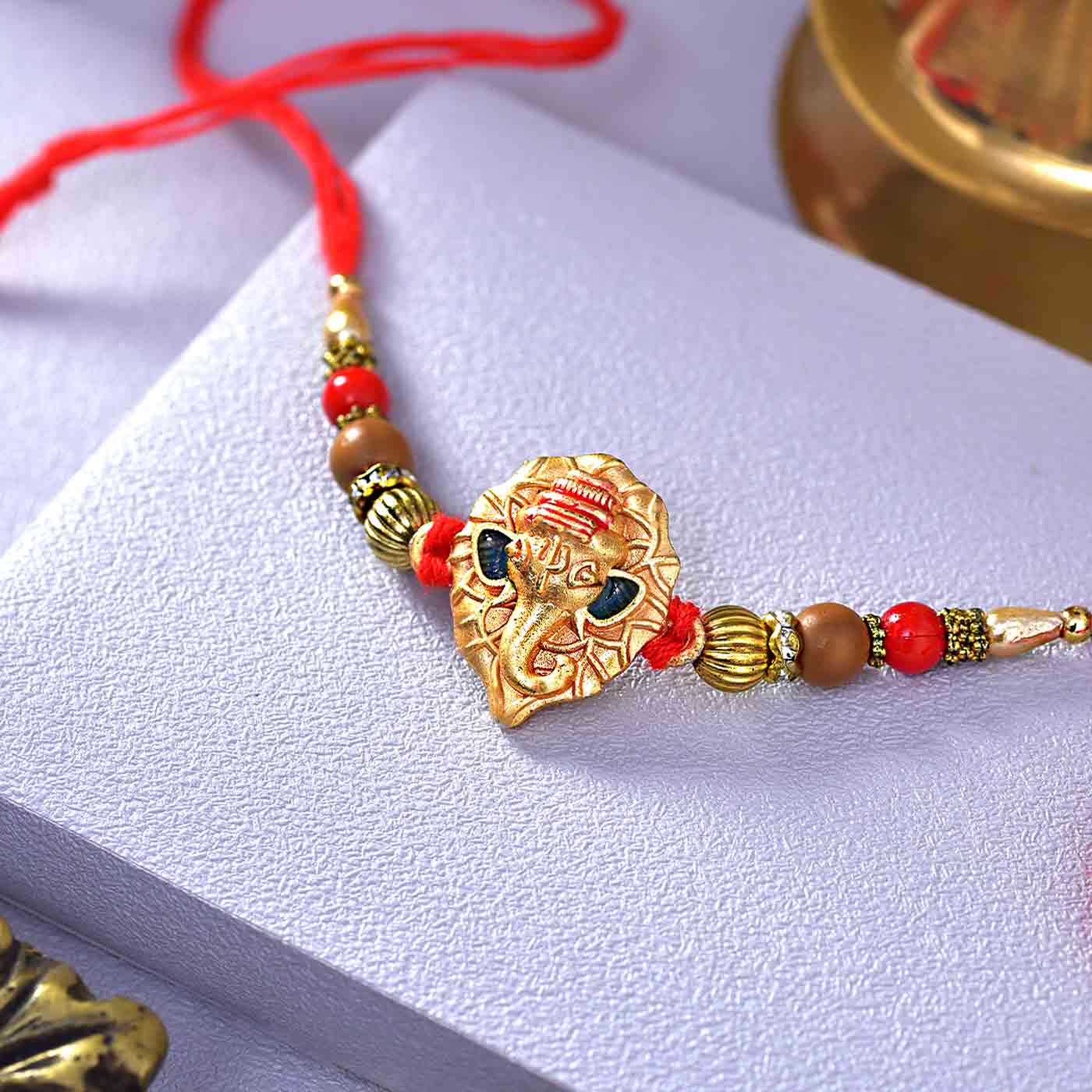 Peepal Patta Ganesha Rakhi #58825 | Buy Send Rakhi To India Online